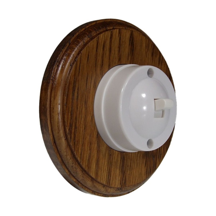 1G Push to Make Bakelite White Dolly Switch on a Round Medium Oak Base